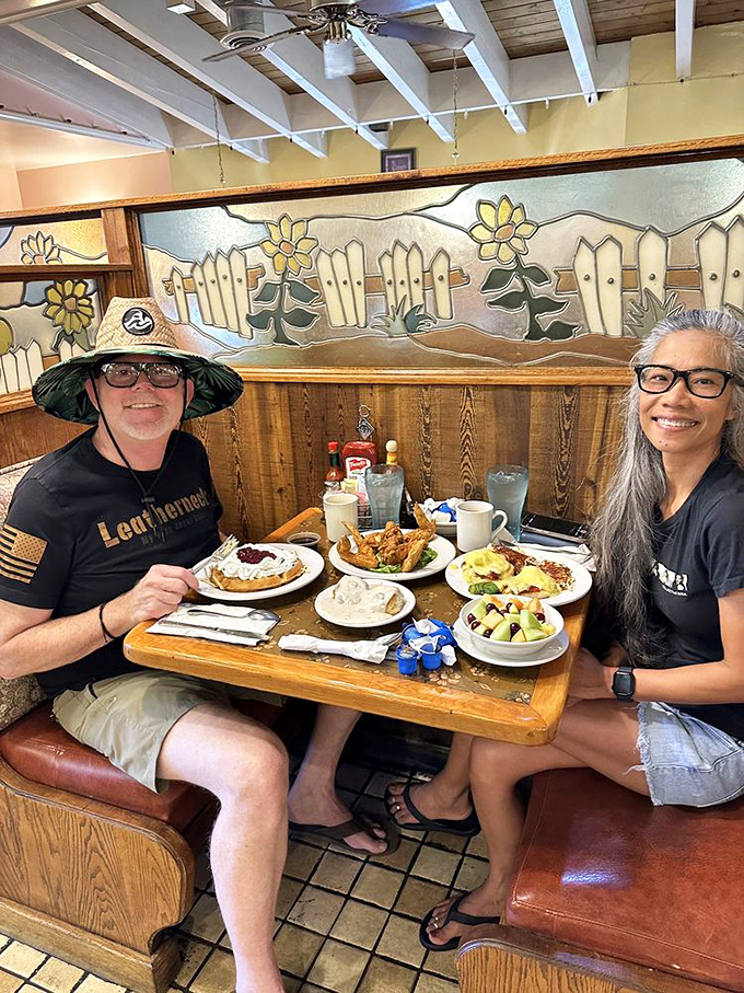 Happy diners surrounded by a feast that would make any breakfast enthusiast weak at the knees. This is what food joy looks like.
