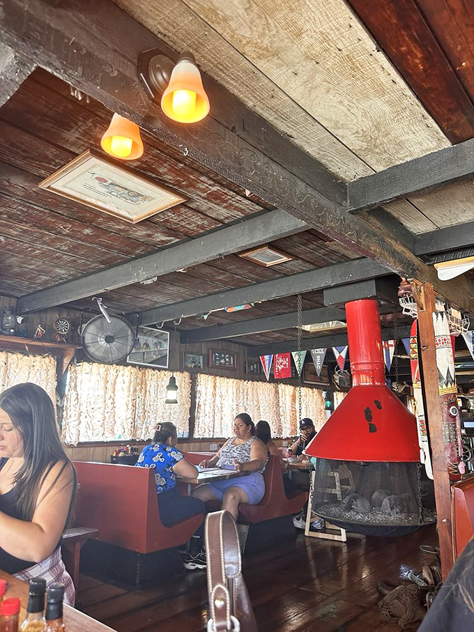 Where every meal feels like a special occasion. The cozy booths and distinctive red stove create the perfect backdrop for making memories over mussels.