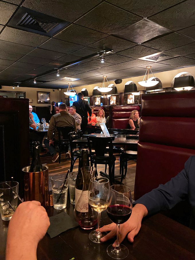 High-backed booths creating intimate dining nooks &ndash; where deals are sealed and anniversaries properly celebrated.