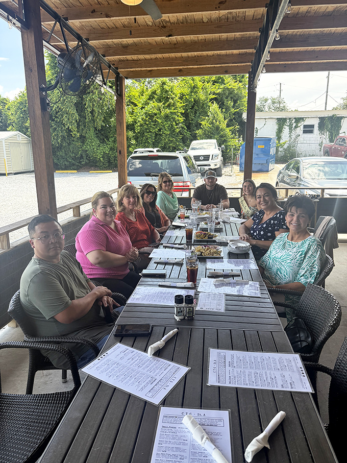 The outdoor patio where locals and visitors alike gather to share meals, stories, and that unique Panama City sunshine that seems to make everything taste better.