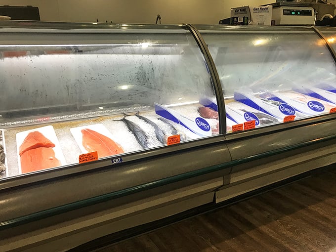 The seafood display case&mdash;where tomorrow's dinner still has that oceanic gleam, a transparent promise that "fresh" isn't just marketing jargon at Happy Snapper.