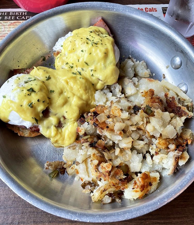 Eggs Benedict with hollandaise so yellow it could brighten a rainy day, nestled beside home fries that achieved the perfect crisp-to-fluffy ratio.