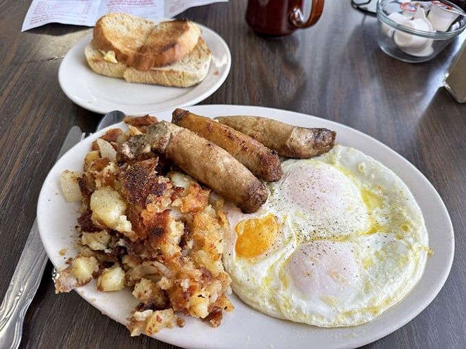 The breakfast trinity&mdash;golden eggs, crispy potatoes, and sausage links that snap when you bite them. Some traditions deserve to be preserved forever.