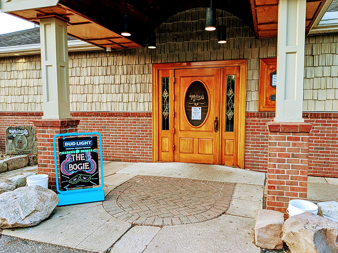 The wooden door with stained glass welcomes you like an old friend, while the sign promises exactly what you came for.