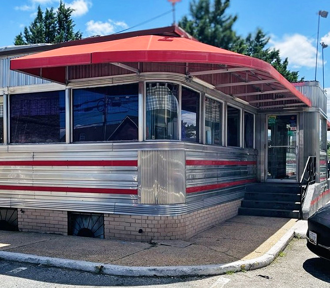 The curved corner entrance with its distinctive red awning has welcomed generations of Marylanders seeking comfort in carbohydrate form.