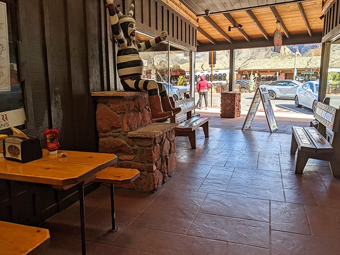 The entrance beckons with rustic charm and the promise of honest food, where even the stone walls seem to whisper, "Come hungry, leave happy."