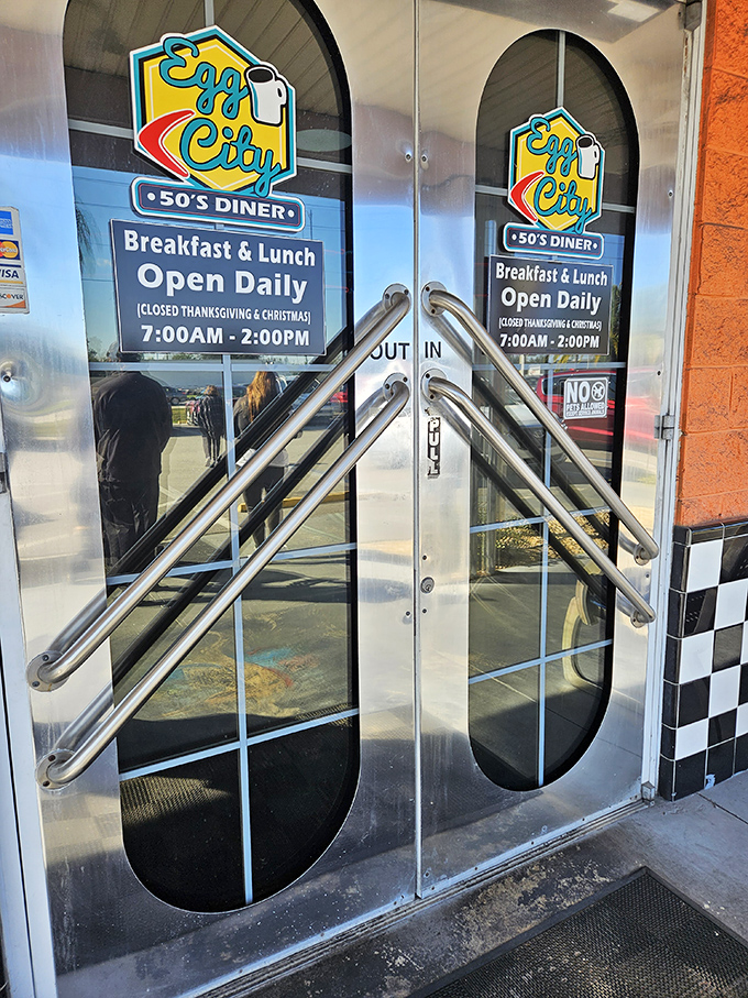 The entrance doors with their porthole windows and hours posted aren't just an entry point&mdash;they're a portal to a world where breakfast is served all day.