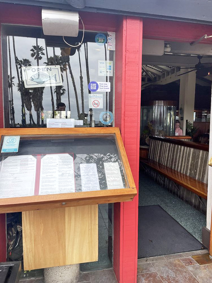 The "OPEN" fish sign isn't just cute&mdash;it's the maritime equivalent of a lighthouse, guiding hungry sailors to safe harbor.