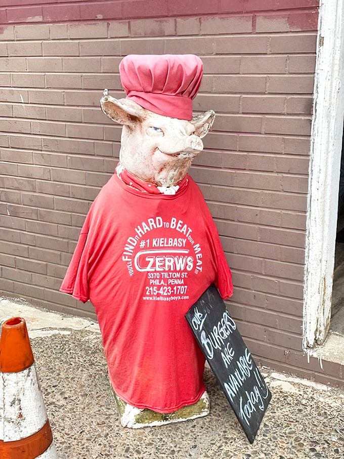 Even the pig statue outside wears the company shirt with pride. When your mascot looks this happy, you know you're in for something special.