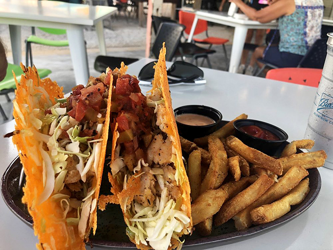 Crispy fish tacos with fresh slaw and zesty sauce&mdash;handheld happiness that captures the essence of coastal Florida in every bite.