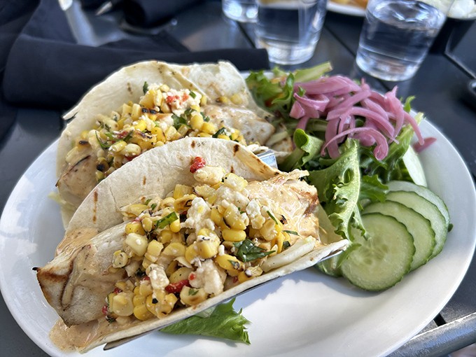 Tacos that tell a coastal story. Fresh fish, bright corn salsa, and crisp vegetables create handheld masterpieces that capture Florida's vibrant flavors.