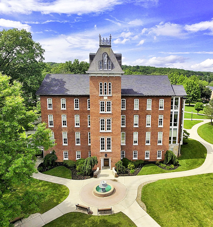 Founders Hall rises majestically from manicured grounds, its brick tower and symmetrical design embodying the timeless dignity of small-town Pennsylvania education.