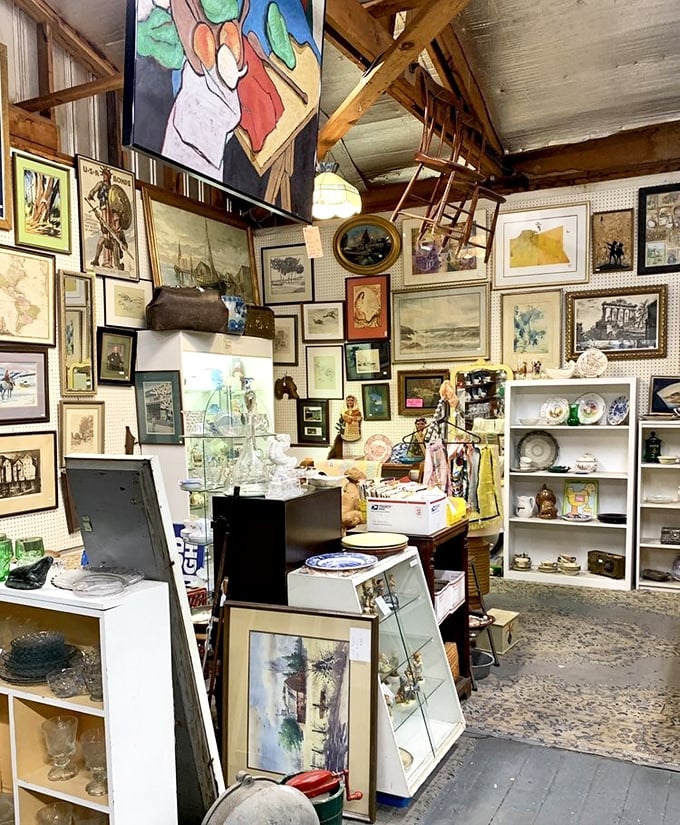 The art wall could rival small galleries, with paintings stacked salon-style from floor to ceiling. Someone's grandmother painted that landscape, guaranteed.