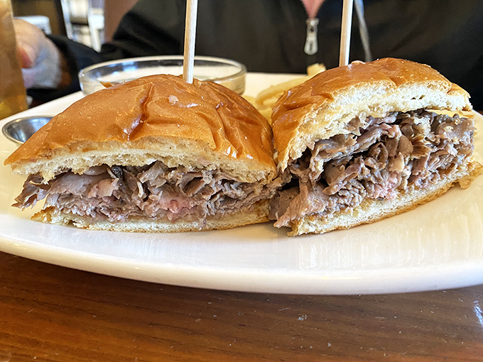 The French dip sandwich: thinly sliced prime rib nestled in a pillowy roll, just waiting for its inevitable au jus baptism.