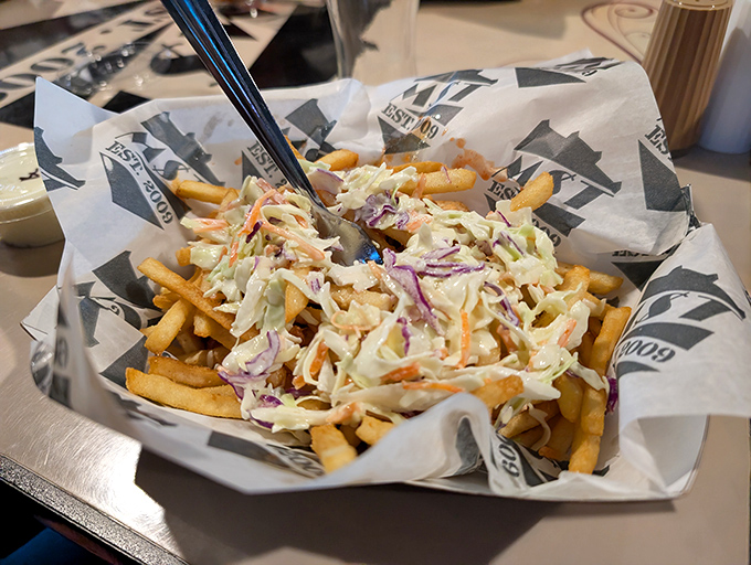 Fries wearing a creamy slaw hat&mdash;because naked fries are so last century. This loaded masterpiece demands both a fork and your full attention.