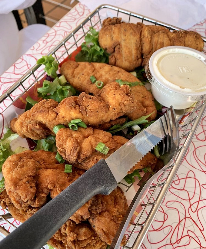 Fried chicken that would make your grandmother jealous. Crispy, juicy, and served with enough greens to pretend you're eating a balanced meal.