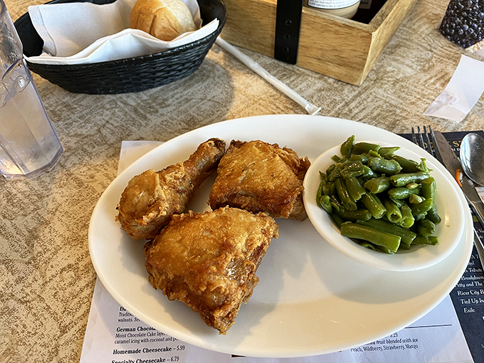 Fried chicken so perfectly golden it deserves its own Instagram account, with green beans that somehow make vegetables exciting again.