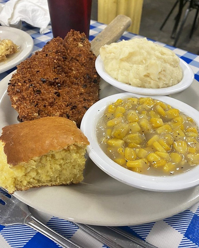 This golden-crusted pork chop with creamy sides and cornbread isn't just a meal&mdash;it's edible Southern hospitality.
