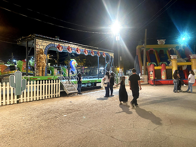 The swap meet transforms into a carnival after dark, complete with rides and games. Who said bargain hunting couldn't include a side of adrenaline?