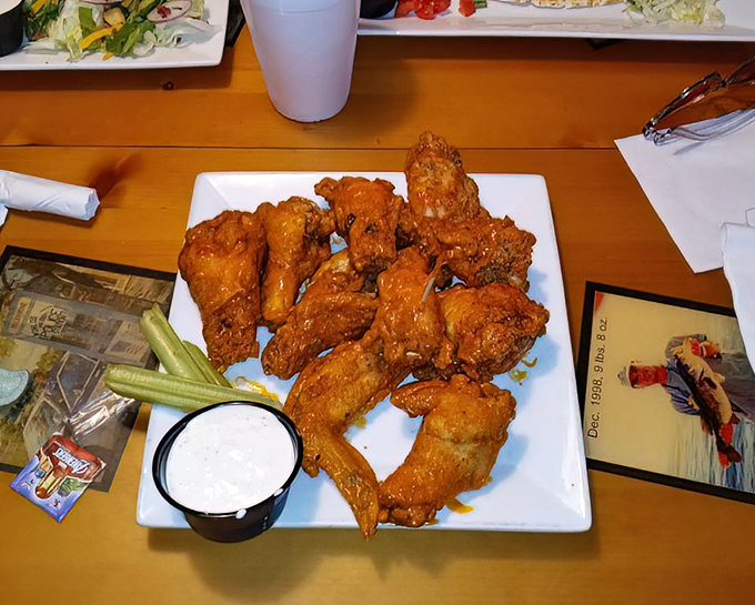 Wings so perfectly crispy they practically announce their arrival before the server reaches your table.