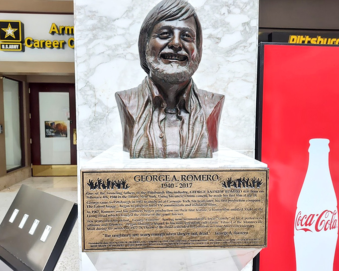 George Romero's memorial bust honors the man who changed horror forever. Without him, zombies might still be shuffling aimlessly without purpose &ndash; like teenagers at a mall.