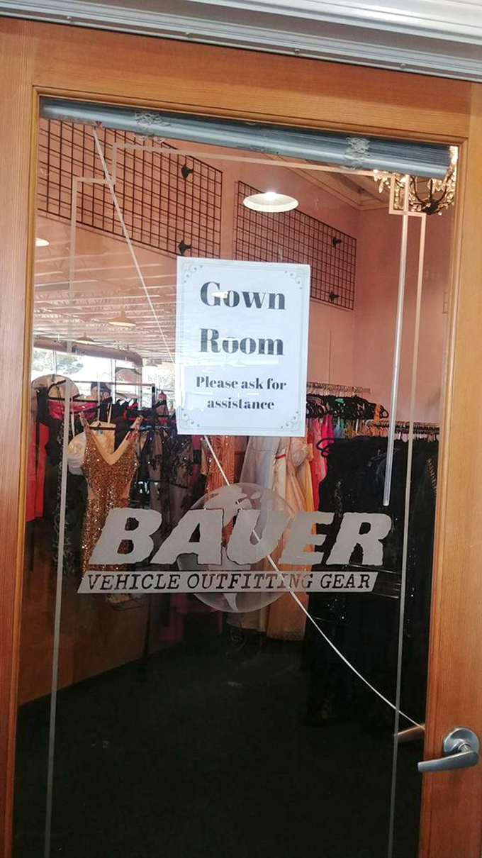 The "Gown Room" sign promises formal wear fantasies at thrift store prices. Prom dresses and wedding attire get the special treatment they deserve.