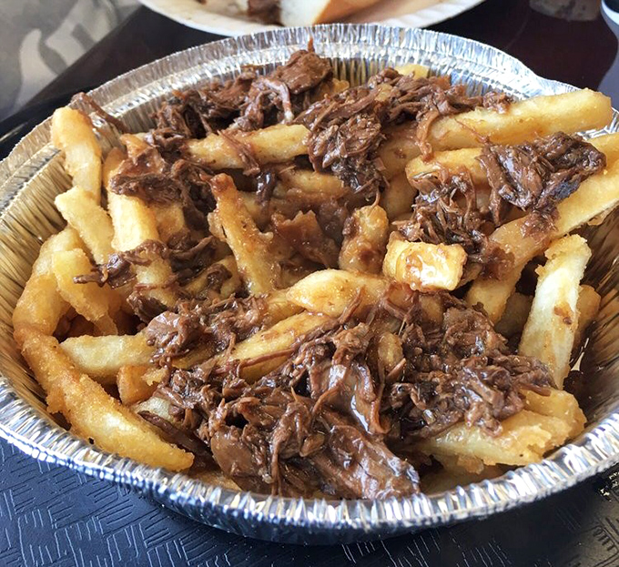 Gravy fries: where French fries go for their spa treatment. Tender shredded beef relaxes atop golden potatoes in a tin foil hot tub.