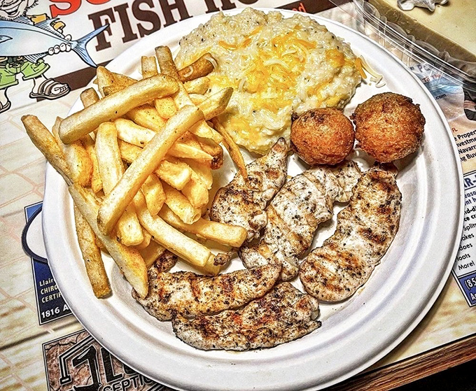 Proof that Scooter's grilled options deserve as much acclaim as their fried counterparts. Tender chicken, golden fries, and cheesy potato salad form a triumvirate of comfort.