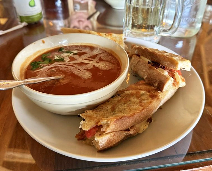 A grilled cheese sandwich that's achieved golden perfection meets its soulmate &ndash; a bowl of tomato soup that's begging for that first dunk.