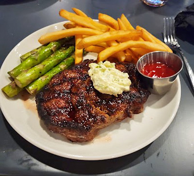 A steak that doesn't need a fancy steakhouse to prove its worth. That butter melting on top is performing culinary poetry.