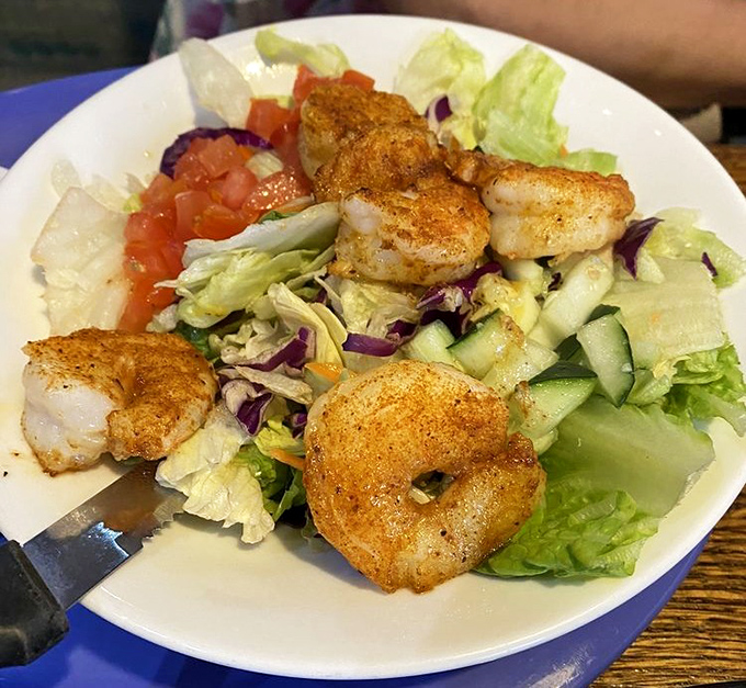 Grilled shrimp salad for when you want to feel virtuous while still indulging. Those perfectly seasoned crustaceans steal the show.