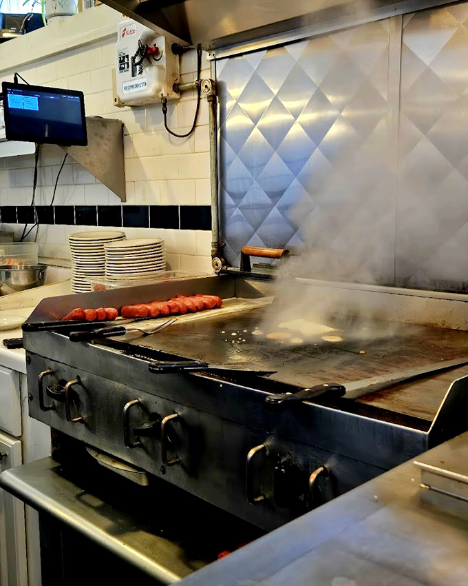 Where the magic happens &ndash; hot dogs sizzling on a well-seasoned flat top that's probably seen more history than most museums.