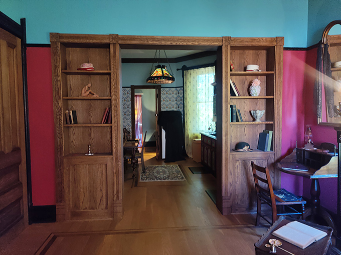 Vibrant walls frame doorways that lead from one mysterious room to another. The architectural details showcase the craftsmanship of a bygone era.