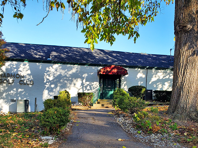 The Harmon Golf Club's inviting entrance promises green fairways beyond, where weekend warriors and serious swingers alike chase that elusive perfect round.