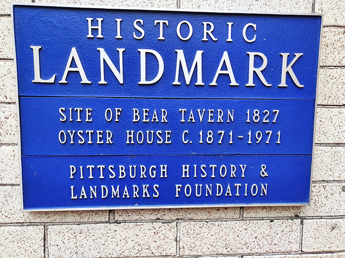 This blue historic landmark plaque doesn't just mark a building—it celebrates a culinary institution that's been feeding Pittsburgh since 1871.