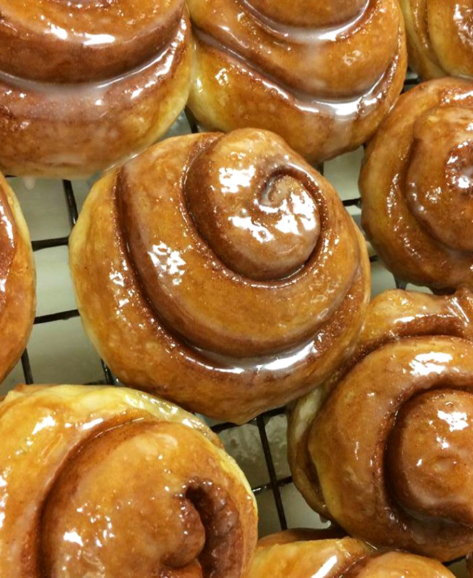 Cinnamon rolls glistening with glaze that would make even the most dedicated carb-avoider reconsider their life choices. Resistance is futile.