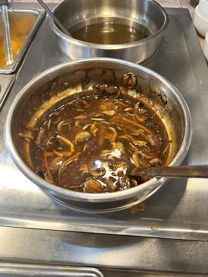 
Hot and sour soup that doesn't mess around&mdash;rich broth swimming with mushrooms and seasonings that clear sinuses and warm souls simultaneously. 