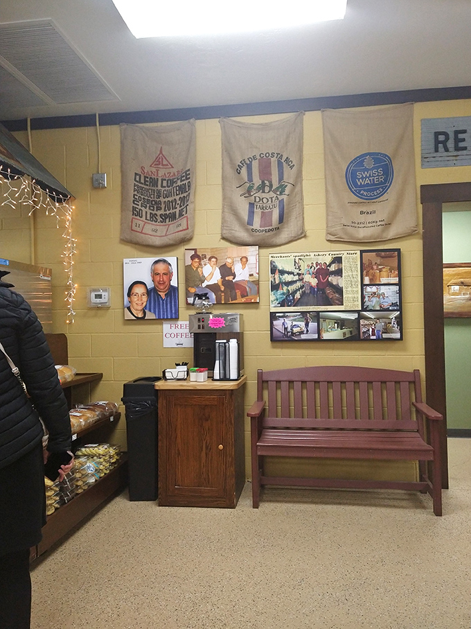 A corner that tells the store's story through vintage flour sacks and photographs, where free coffee is just a bonus.