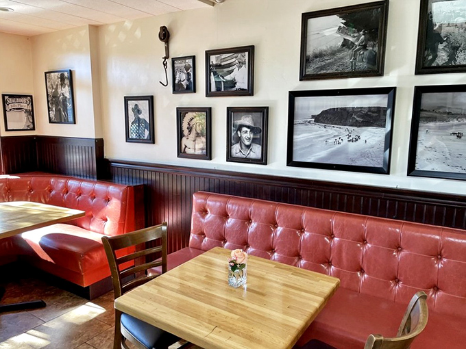 Red tufted booths and vintage photos create that perfect "I've found my new favorite spot" feeling before you even taste the food.