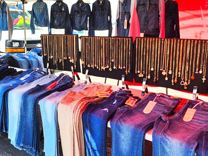 Jewelry displayed with democratic flair&mdash;gold crosses and pendants dangling above denim arranged in a rainbow of blue possibilities.