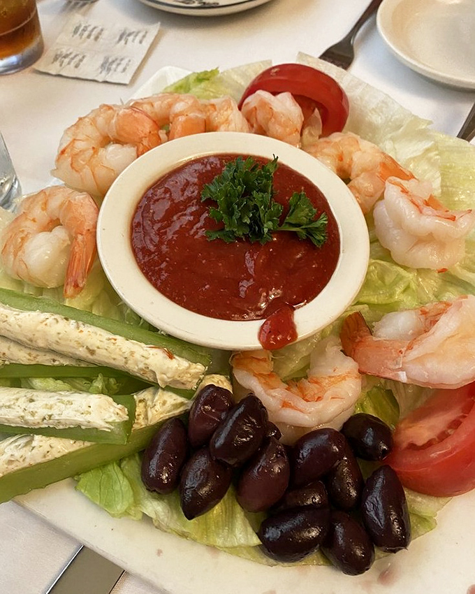 A shrimp platter that's basically a seafood greatest hits album. The cocktail sauce in the center isn't optional&mdash;it's essential to the experience.