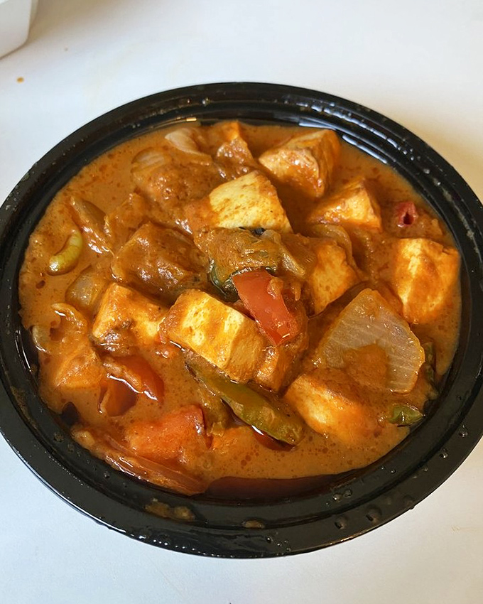 Kadai paneer that's dressed to impress—cubes of homemade cheese playing hide and seek among bell peppers in a tomato-based sauce.