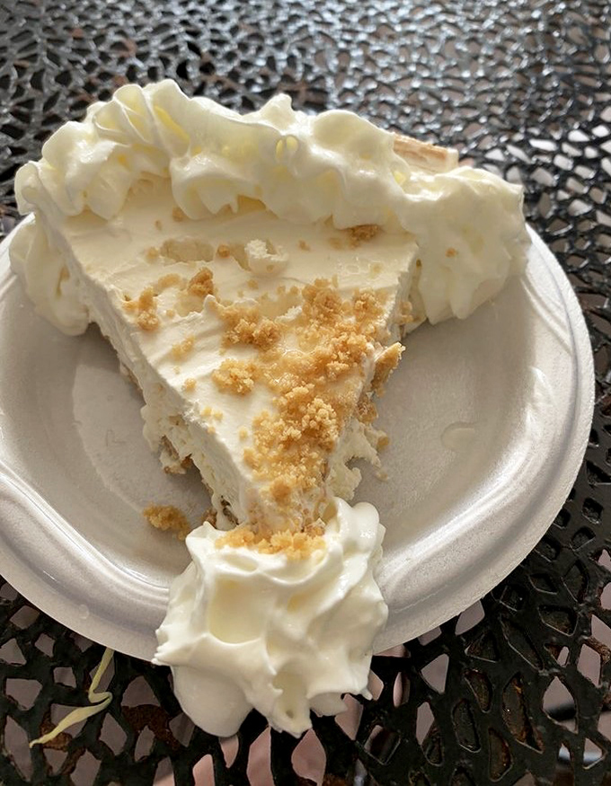 Key lime pie that strikes the perfect balance between sweet and tart – the whipped cream isn't optional, it's essential engineering.