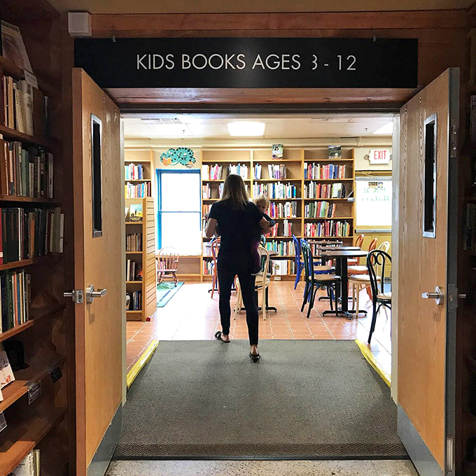 The children's section doorway might as well be a wardrobe to Narnia—a magical portal where young imaginations take flight.