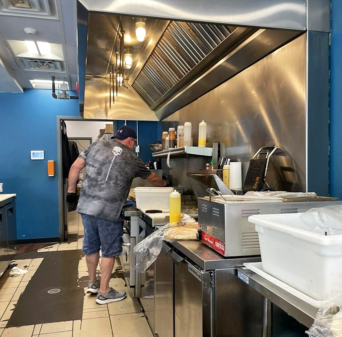 Behind every great sandwich is a dedicated craftsperson. The kitchen choreography is as impressive as the final delicious result.