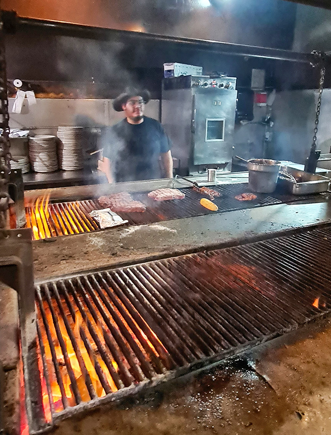 Where the magic happens: Flames leap through the grill as steaks sizzle their way to perfection in a smoky mesquite embrace.
