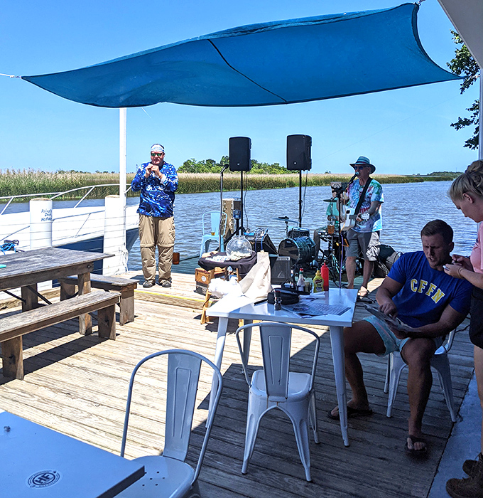 Live music on the dock isn't background noise&mdash;it's the soundtrack to memories being made over fresh seafood and cold drinks.