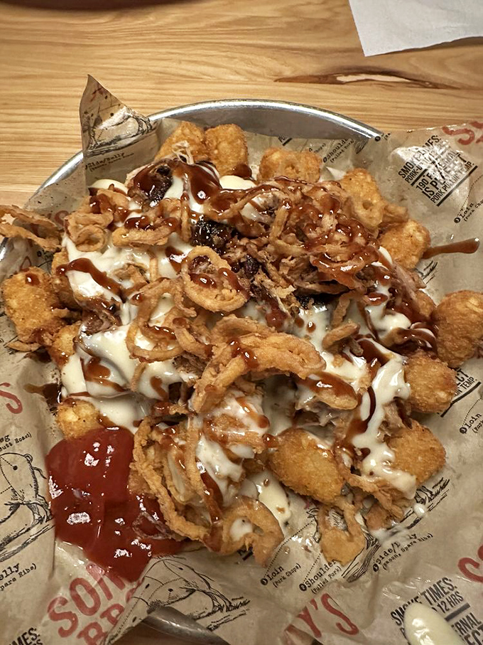 Loaded tots that laugh in the face of diet plans. A glorious mess of crispy potatoes, cheese, sauce, and zero regrets.