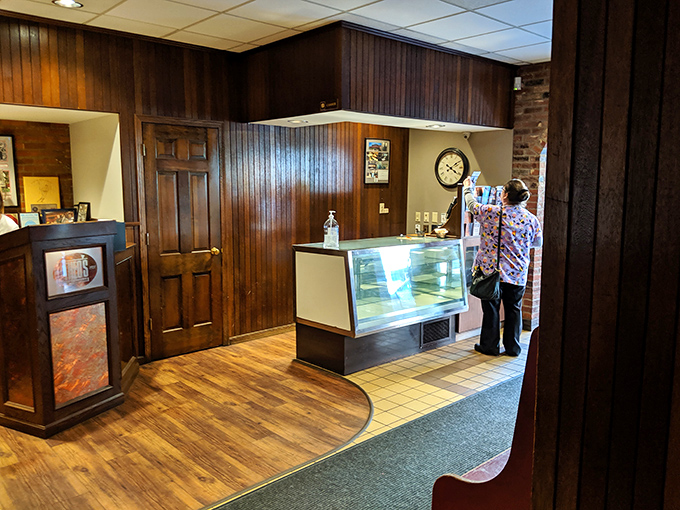The entrance area's display case hints at sweet treasures within—a prelude to the homestyle desserts that have become Theo's signatures.