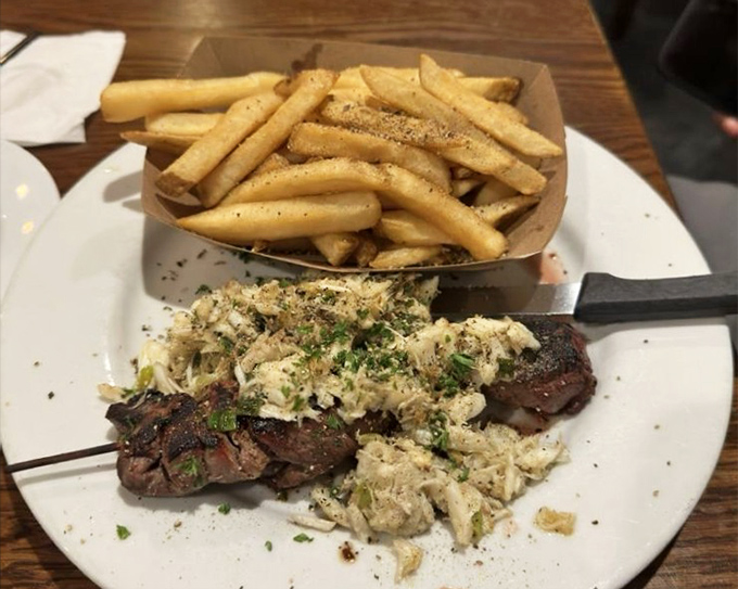Surf meets turf in perfect harmony&mdash;like if Sinatra and Ella Fitzgerald decided to become a steak and crab duet with a side of golden fries. 